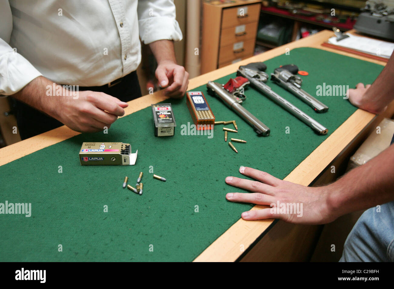 Buying guns hi-res stock photography and images - Alamy