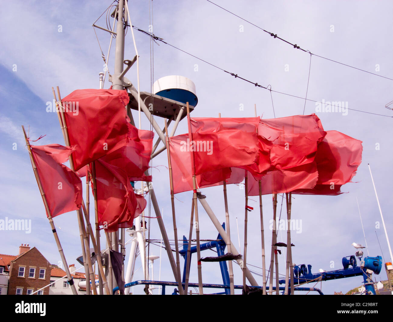 Red flags on marker buoys used for locating crab and lobster pots by ...