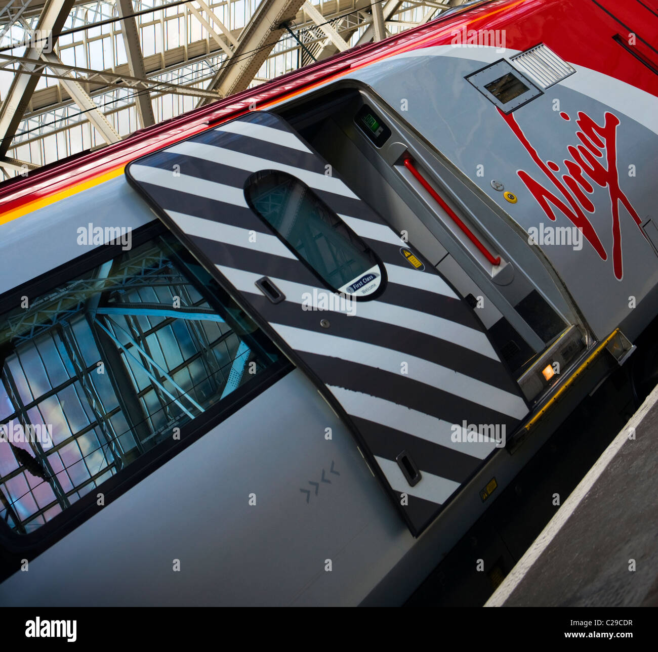 CLOSE UP DETAIL OF A VIRGIN TRAIN AND LOGO AFTER THE LONG JOURNEY FROM ...
