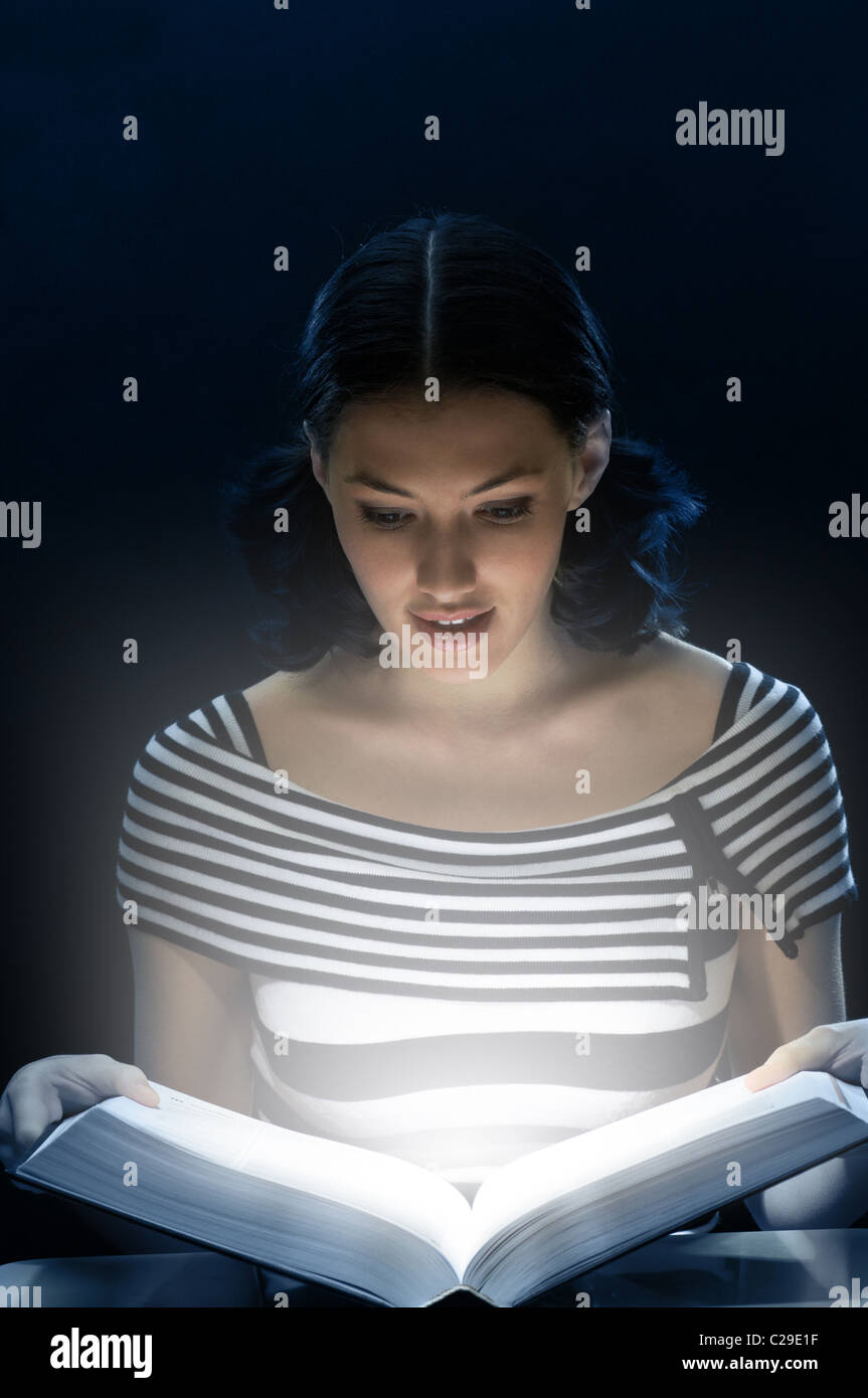 Female reading large book hi-res stock photography and images - Alamy