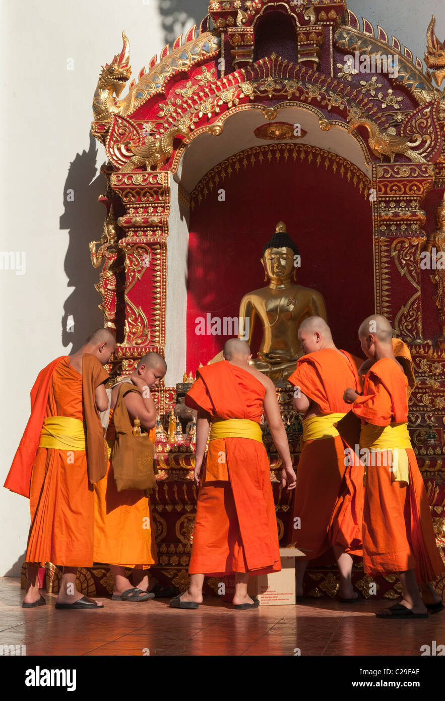 monks praying at Wat Phra Singh Temple in Chiang Mai, Thailand Stock ...