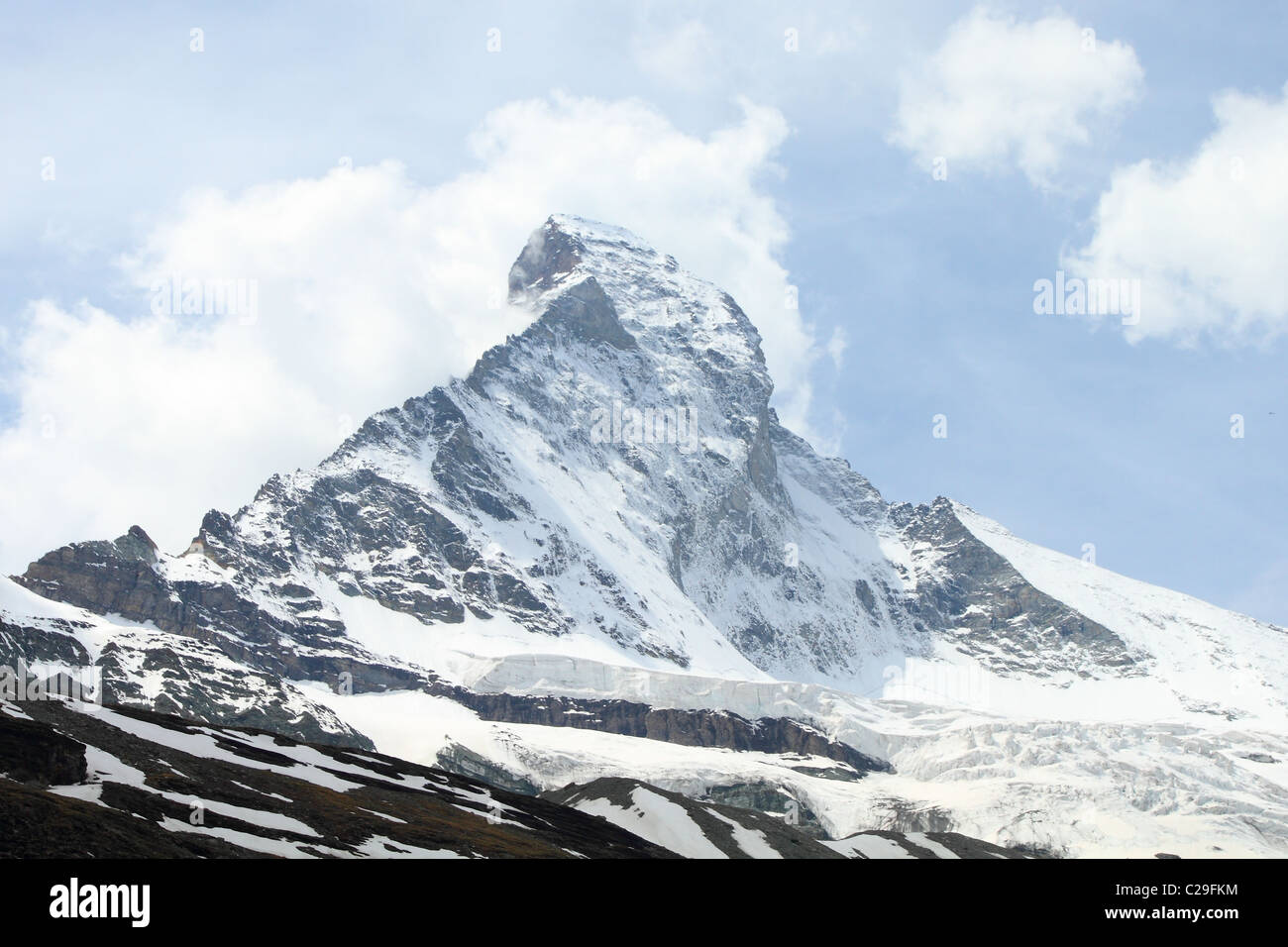 famous swiss iconic mountain Matterhorn rising snow covered from bare ...