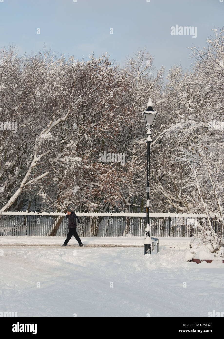 Pedestrian walking in snow Stock Photo - Alamy