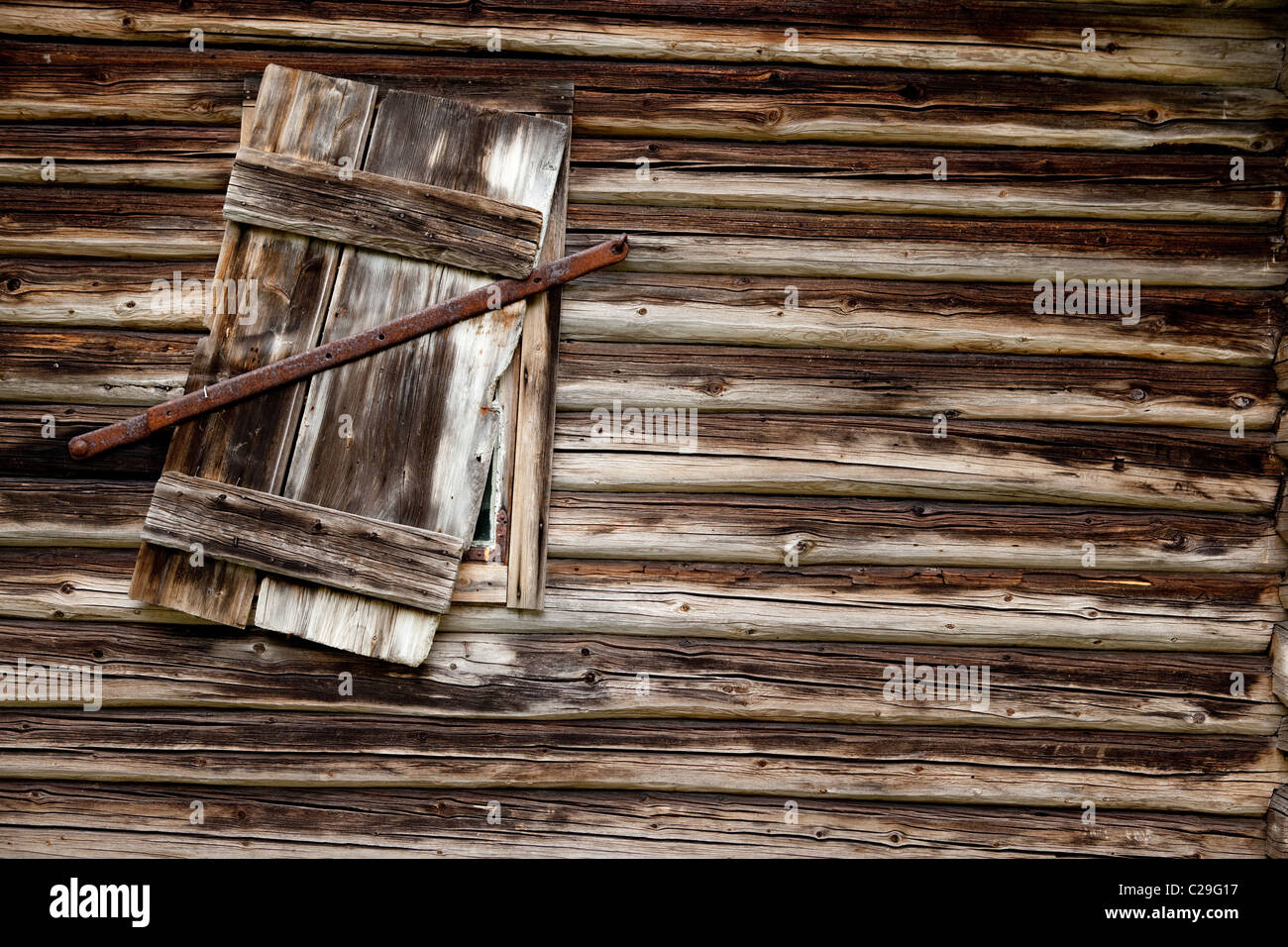 A weathered log cabin background texture with old window Stock Photo ...