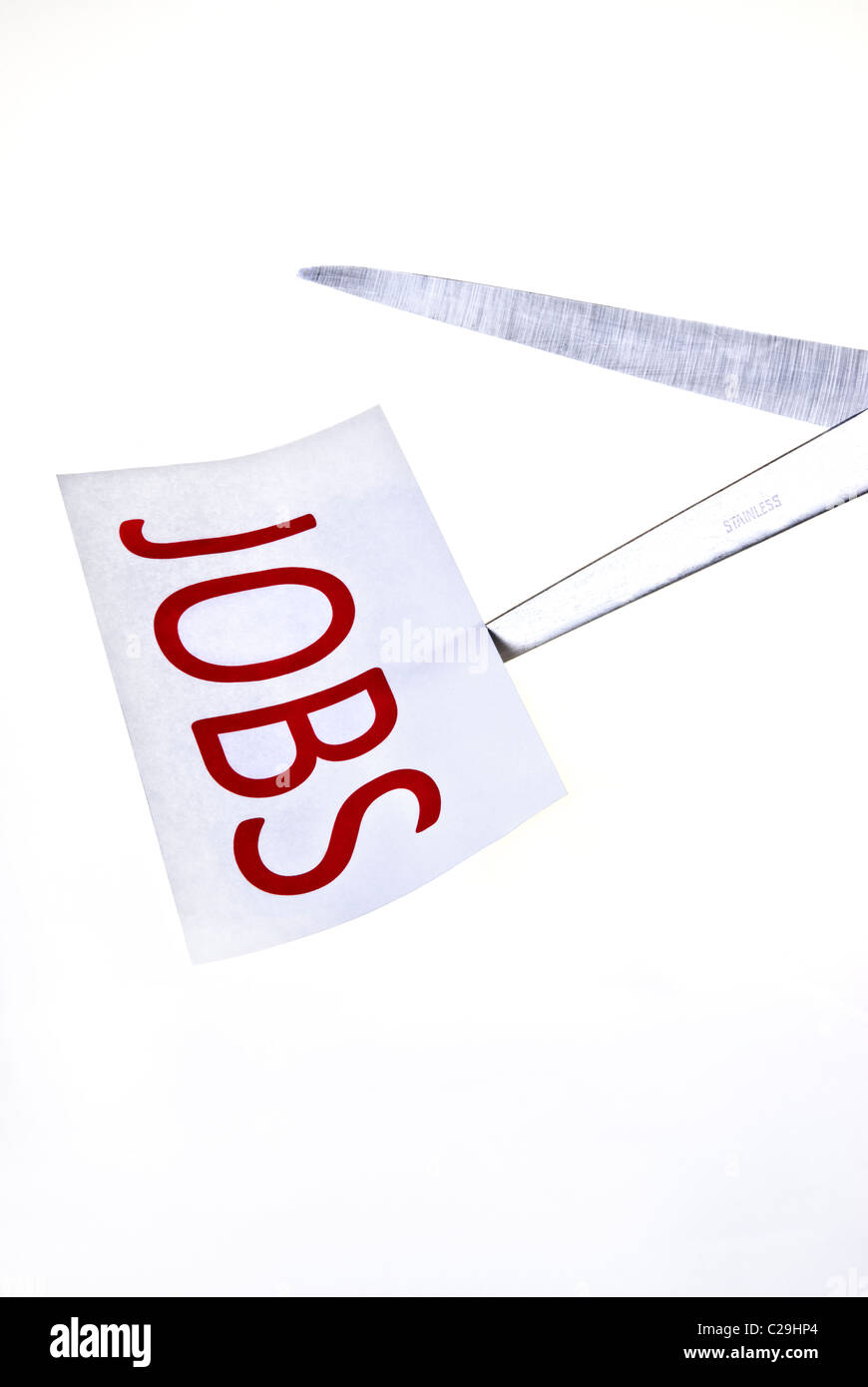 Job Cuts. Scissors cutting paper Stock Photo - Alamy