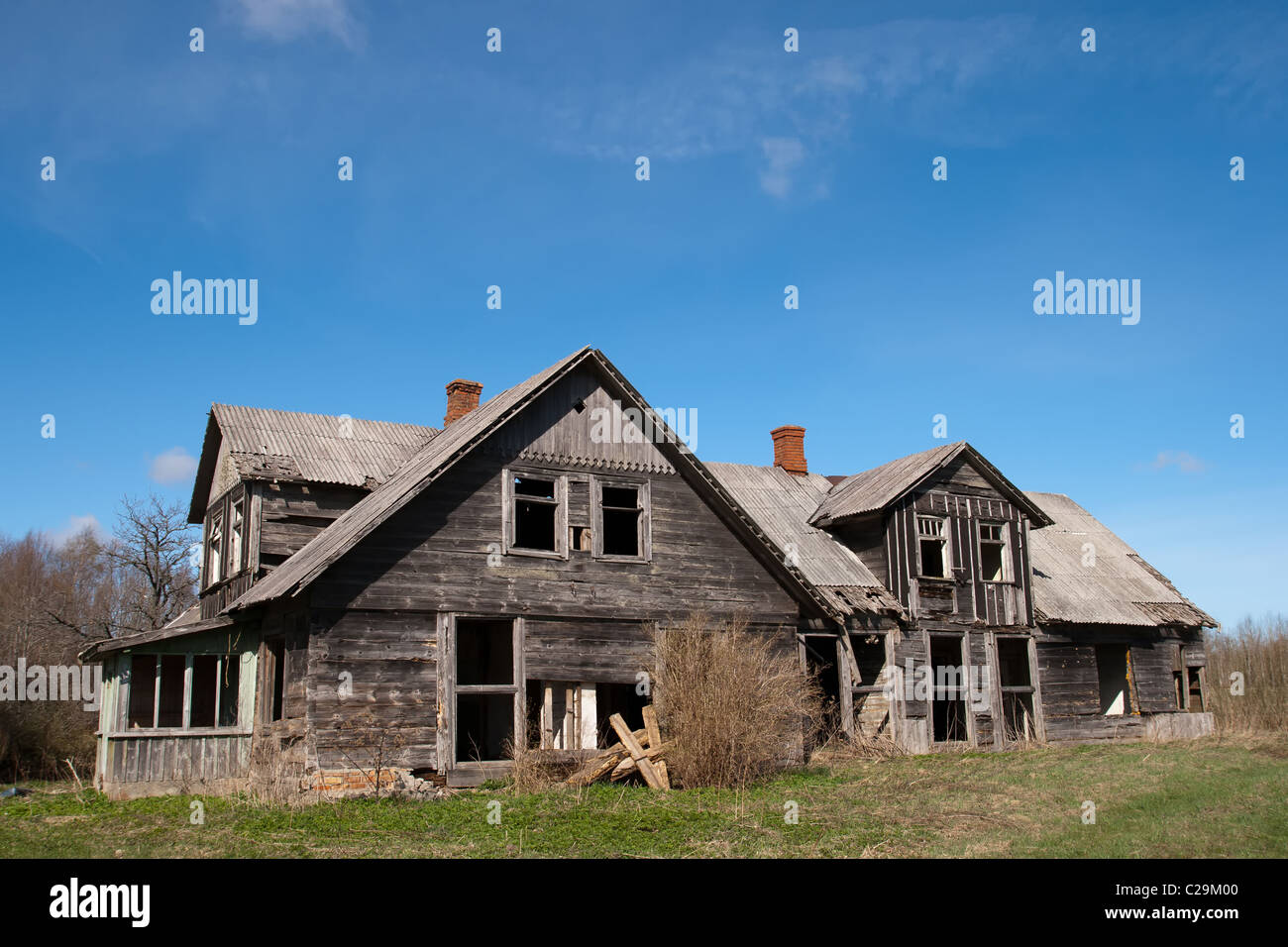 Old wooden abandoned house with broken windows Stock Photo - Alamy
