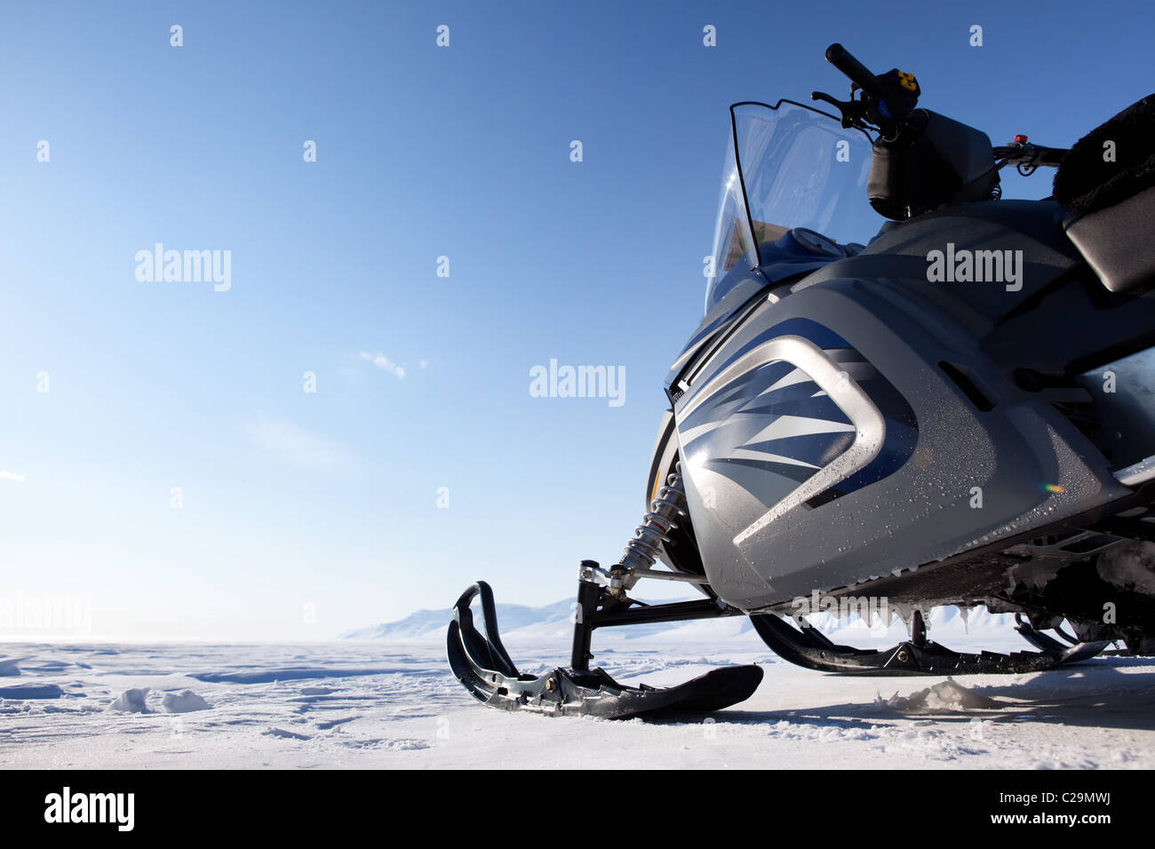 A snowmobile detail on a barren winter landscape Stock Photo - Alamy