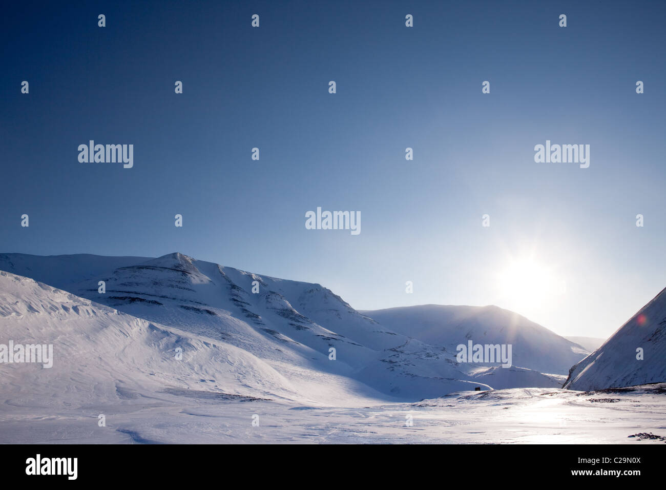 A dramatic winter landscape with snow and mountains Stock Photo - Alamy