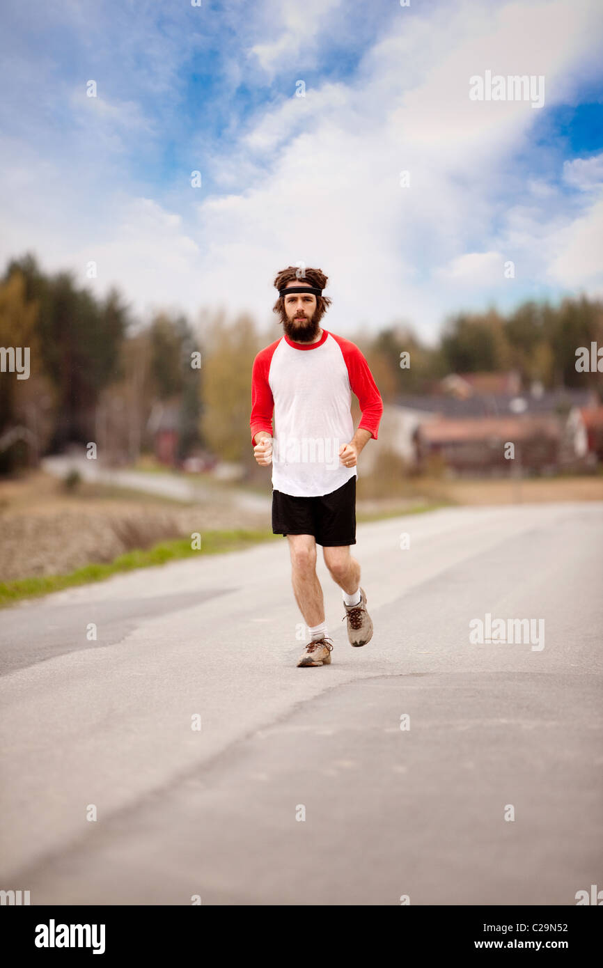 A retro style running in the country on a road Stock Photo - Alamy