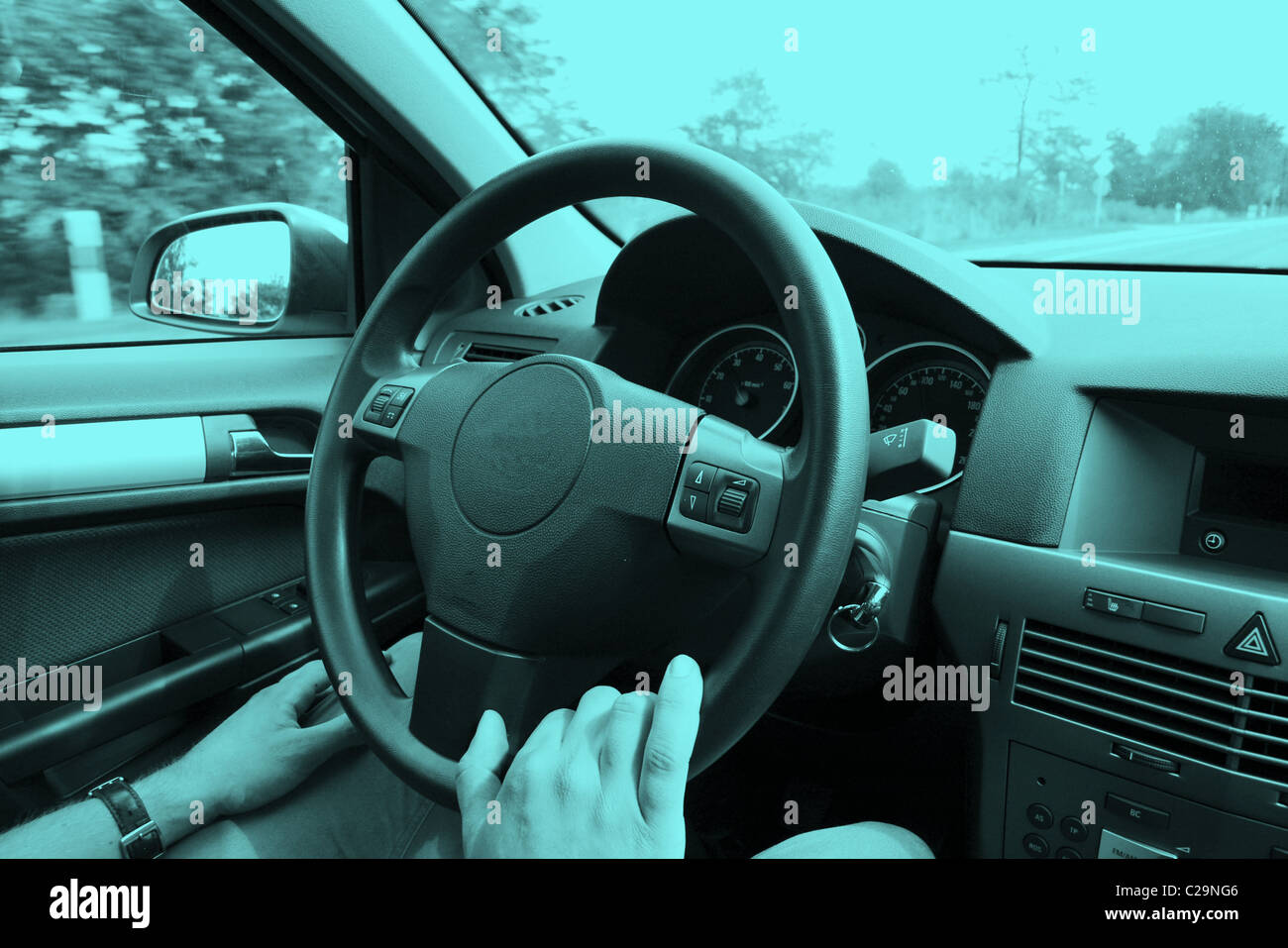 Driving a car viewed from inside, toned image Stock Photo - Alamy