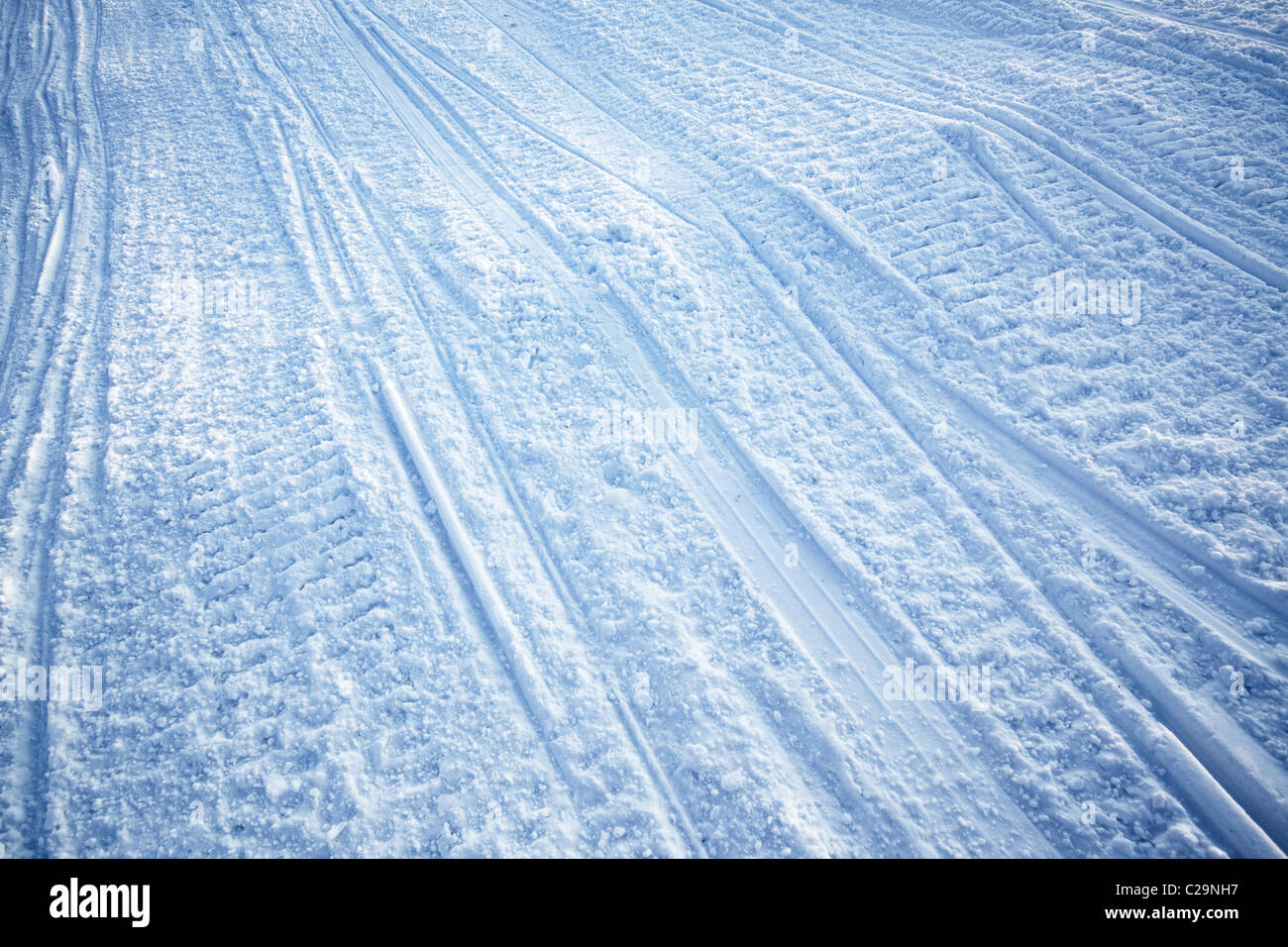 A snow texture of snowmobile tracks converging into the distance Stock ...