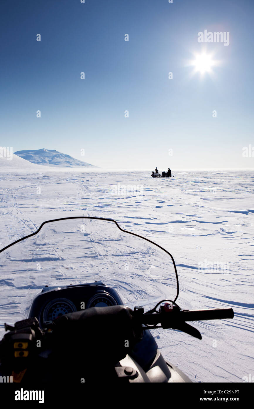 Three snowmobiles on an outdoor winter landscape Stock Photo - Alamy