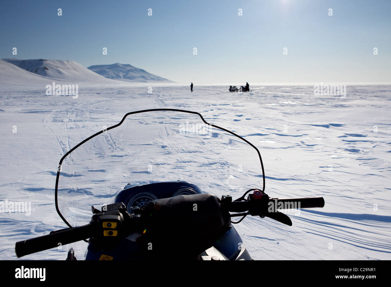 Three snowmobiles on an outdoor winter landscape Stock Photo - Alamy
