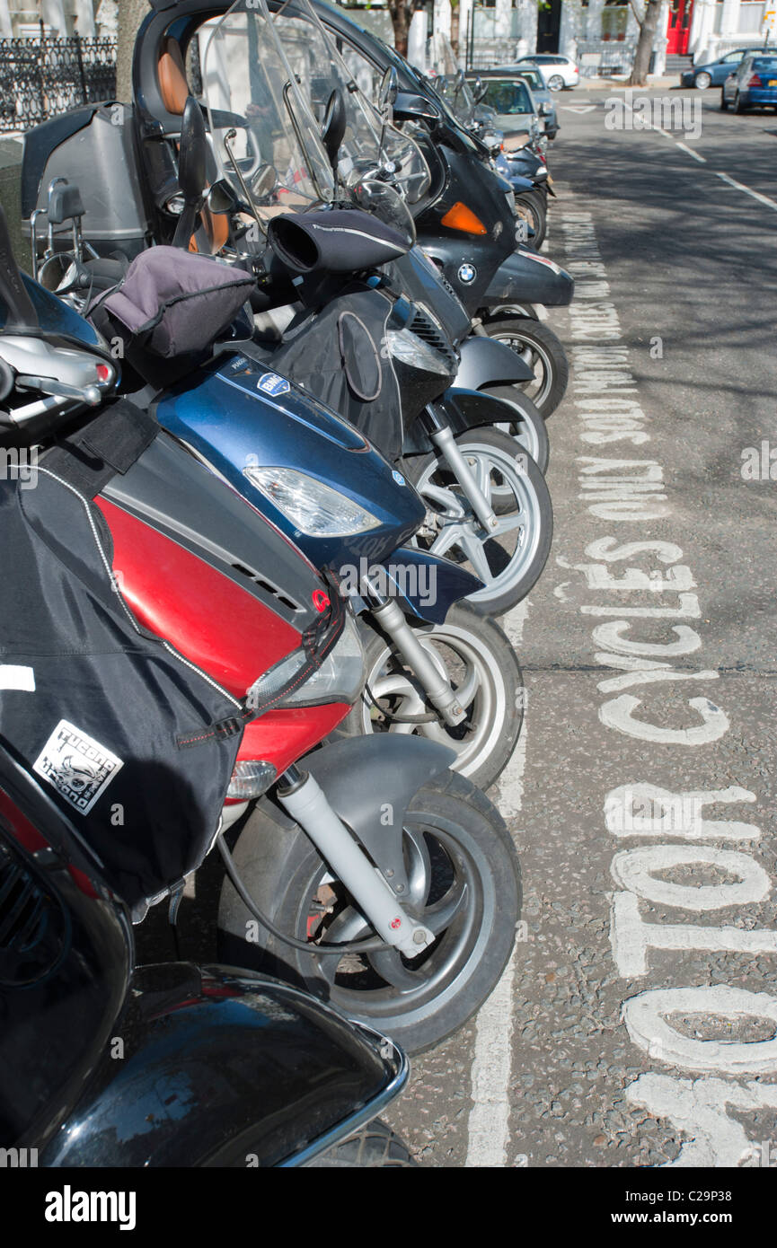 Collection of motorcycles parked in a street in London, England, UK ...