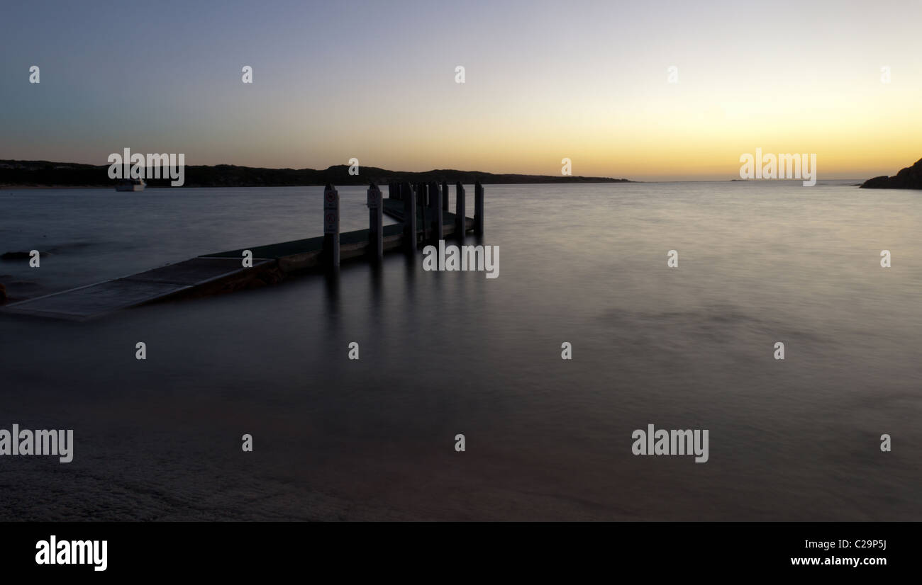 Jetty in late evening sunset Stock Photo - Alamy