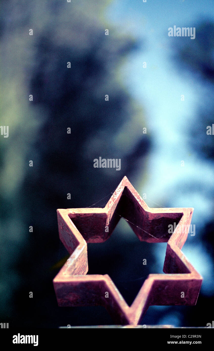 Old rusty Star of David sits on top of gate at kibbutz near National ...