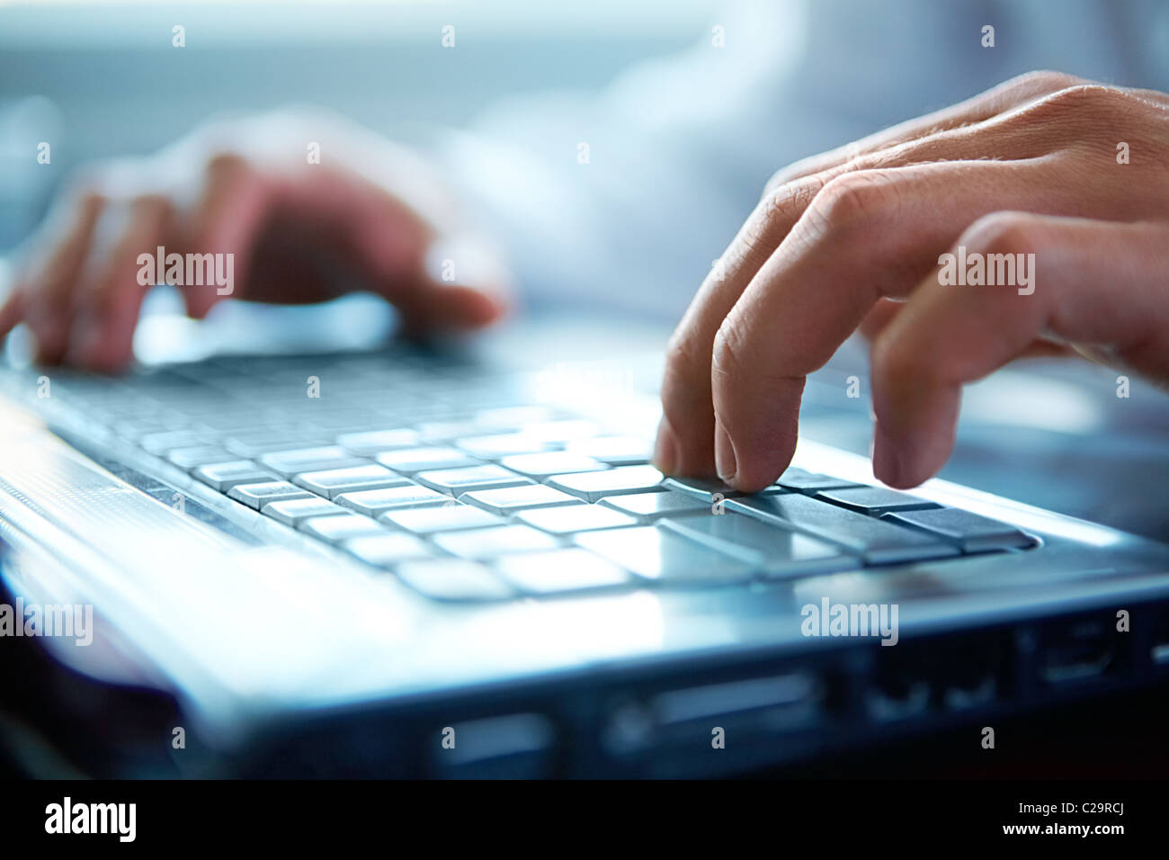Close-up of typing male hands Stock Photo - Alamy