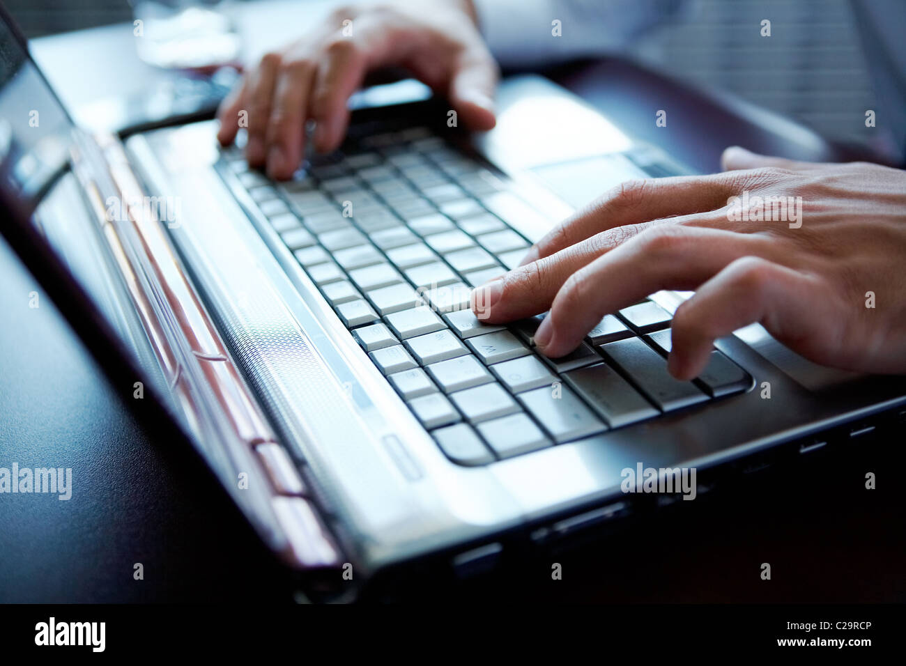 Hands of a man working with computer Stock Photo - Alamy