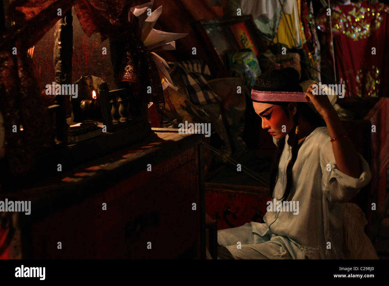 Members of Chinese opera troupe prepare for a show in Udon Thani ...