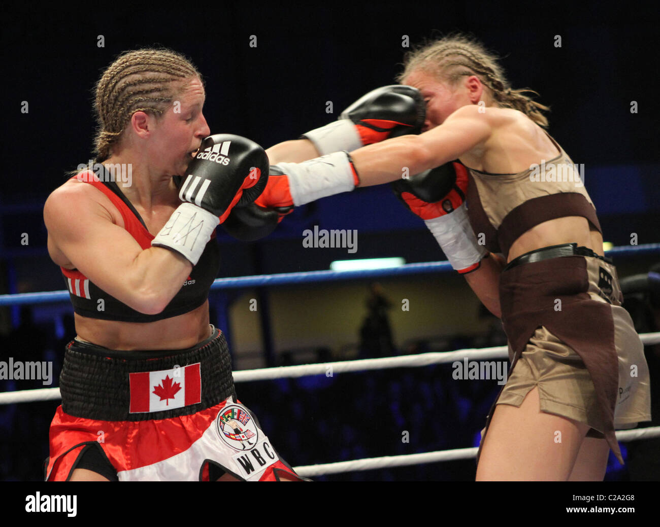 WBC Super-featherweight champion Olivia Gerula (red shorts) from ...