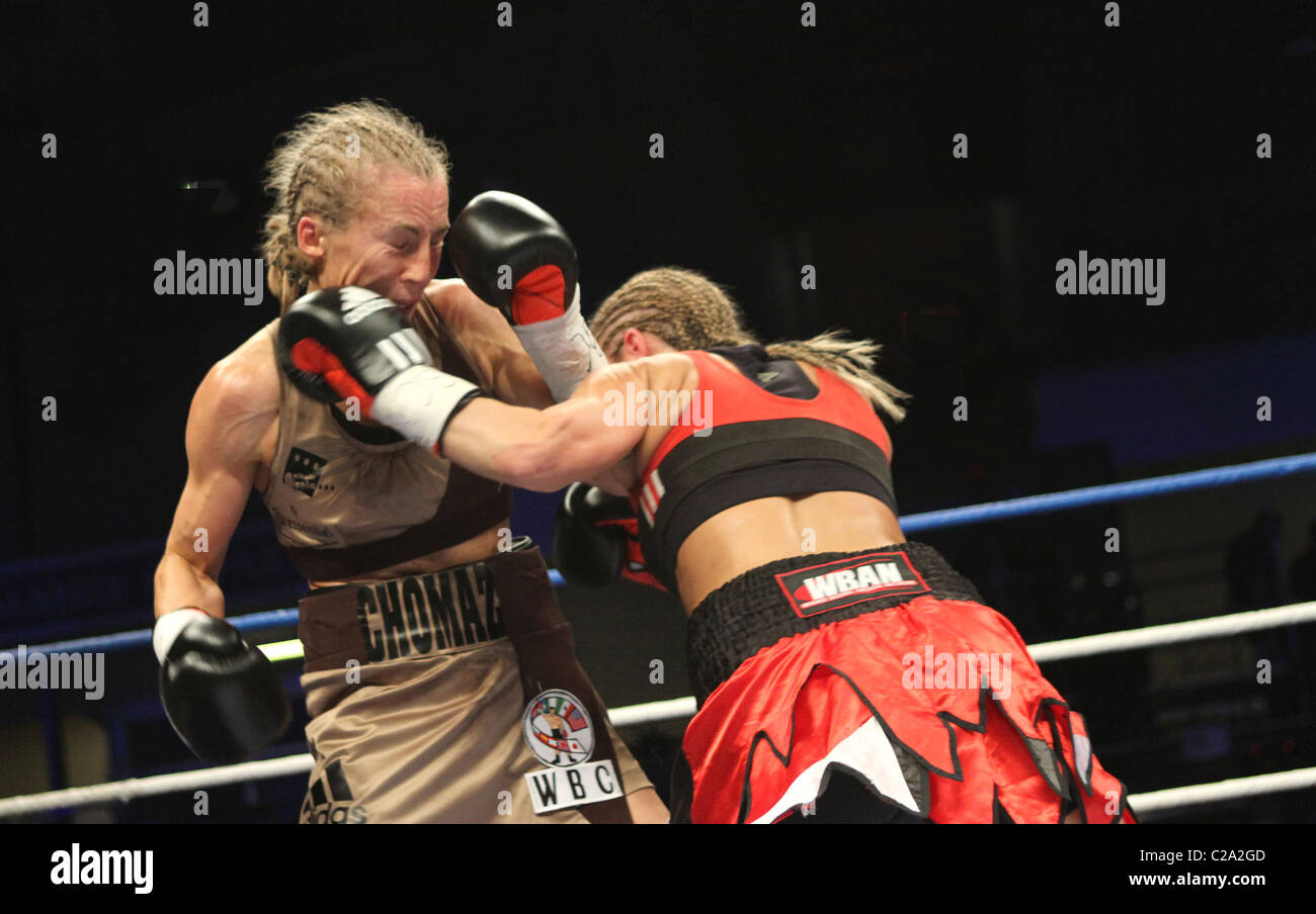 WBC Super-featherweight champion Olivia Gerula (red shorts) from ...
