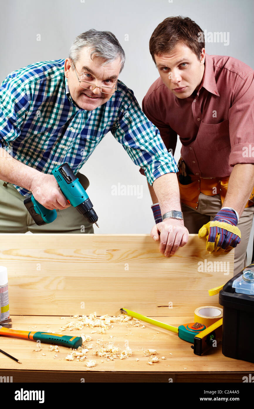 Portrait of two carpenters in workshop Stock Photo - Alamy