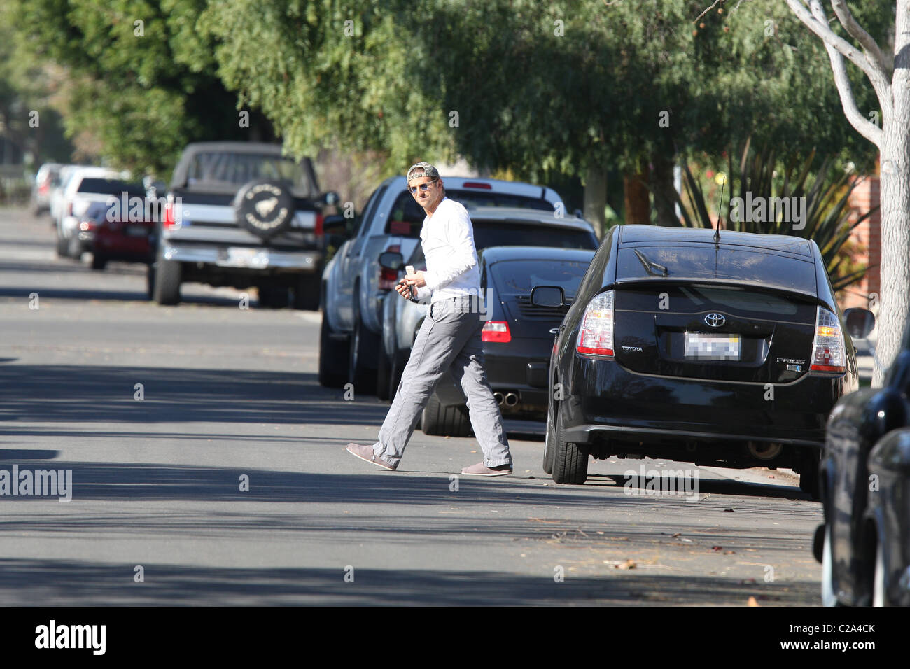 Bradley Cooper arrives back home in his Toyota Prius car, wearing a ...