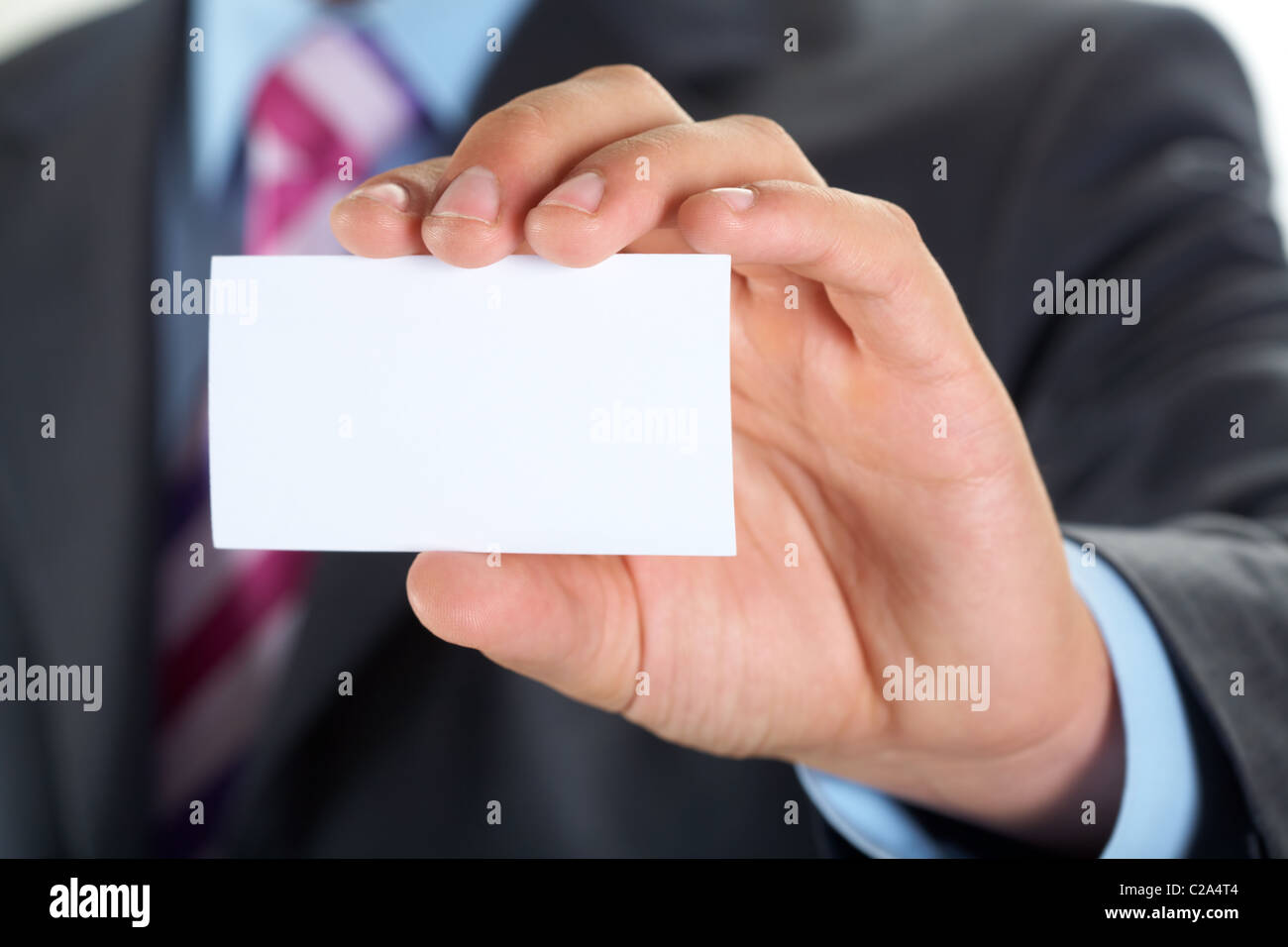 Male hand showing a business card Stock Photo - Alamy