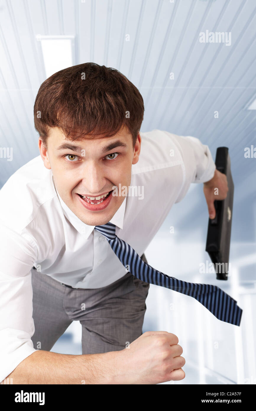 Portrait of a rushing man looking at camera Stock Photo - Alamy