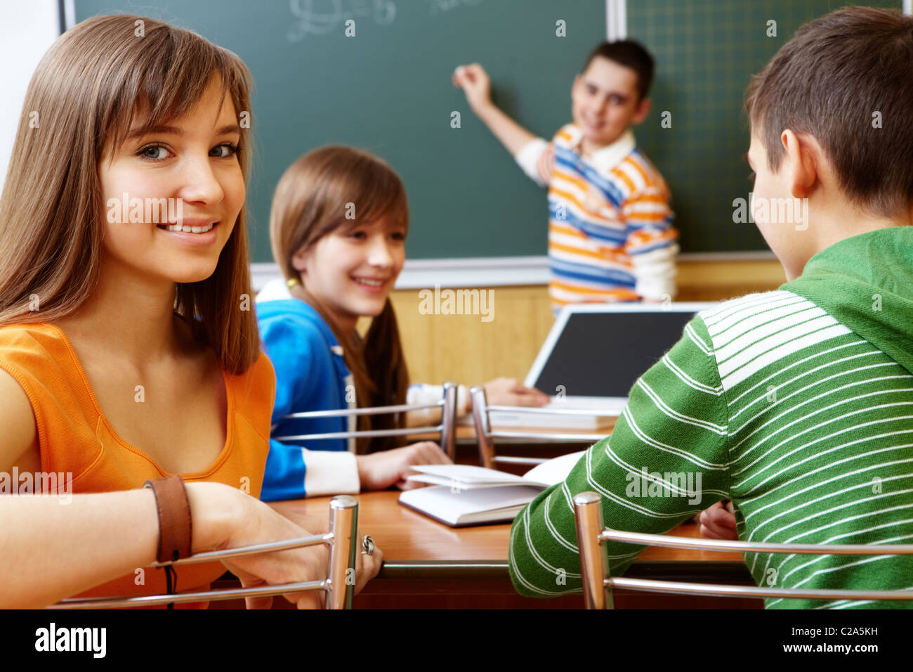 Confident student looking at camera during lesson Stock Photo - Alamy