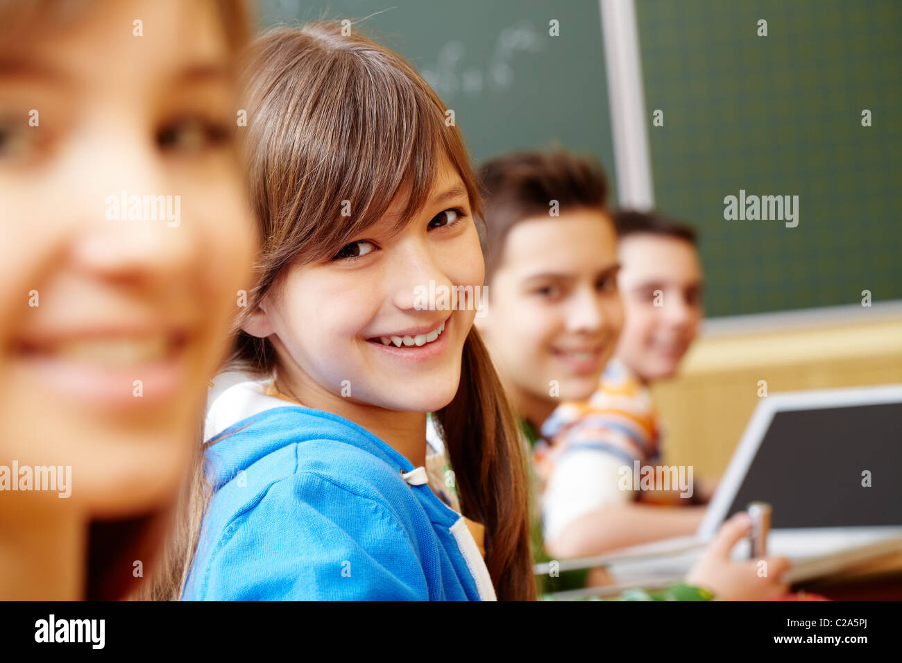 Confident student looking at camera during lesson Stock Photo - Alamy