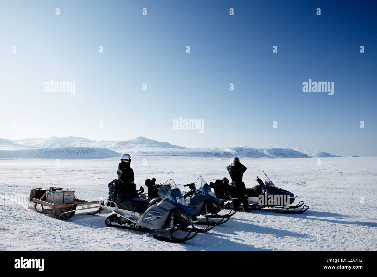 An expedition over a polar winter landscape with frozen ice Stock Photo ...