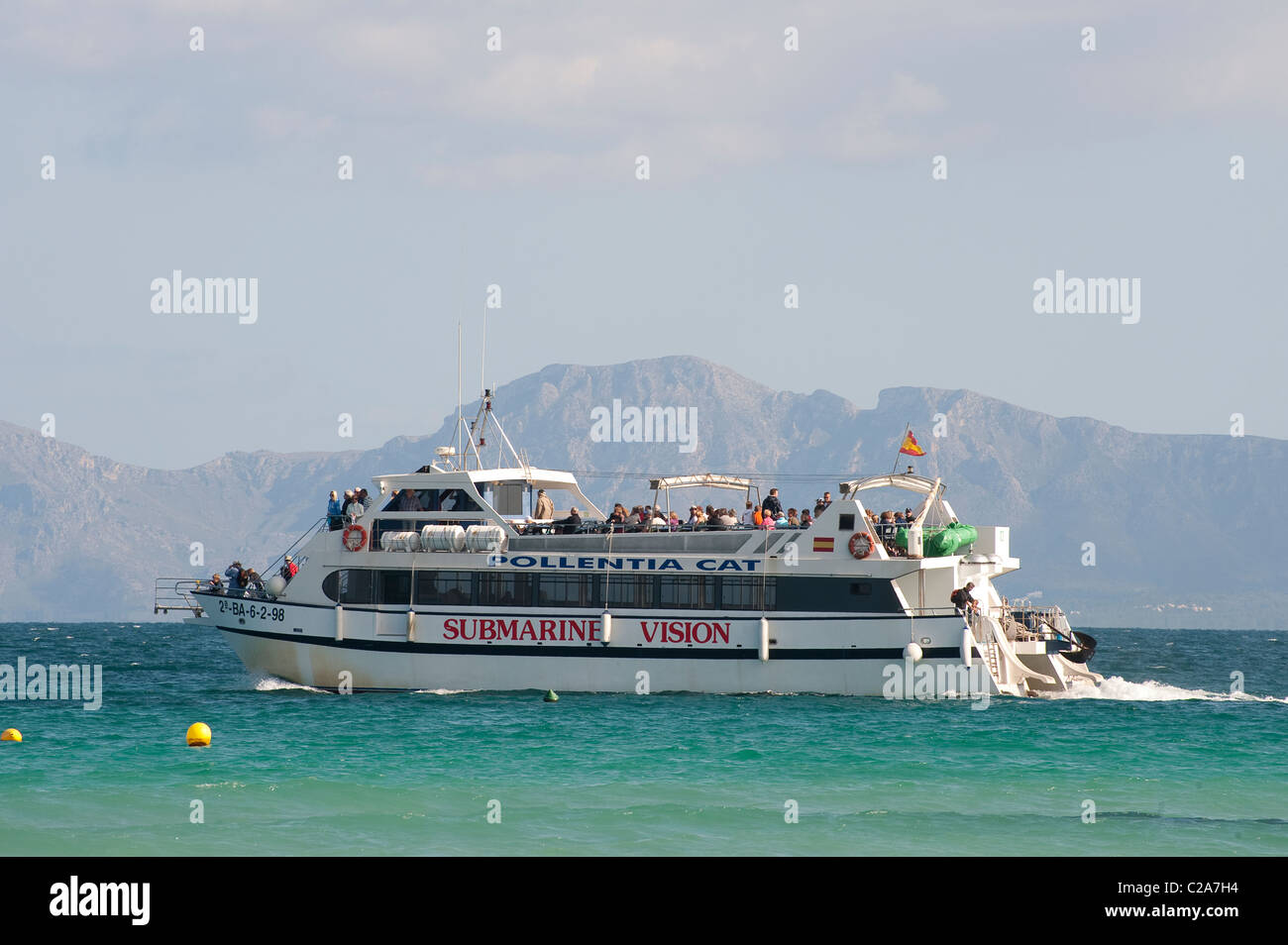 Holidaymakers leaving the glass bottomed Pollentia Cat after a boat ...