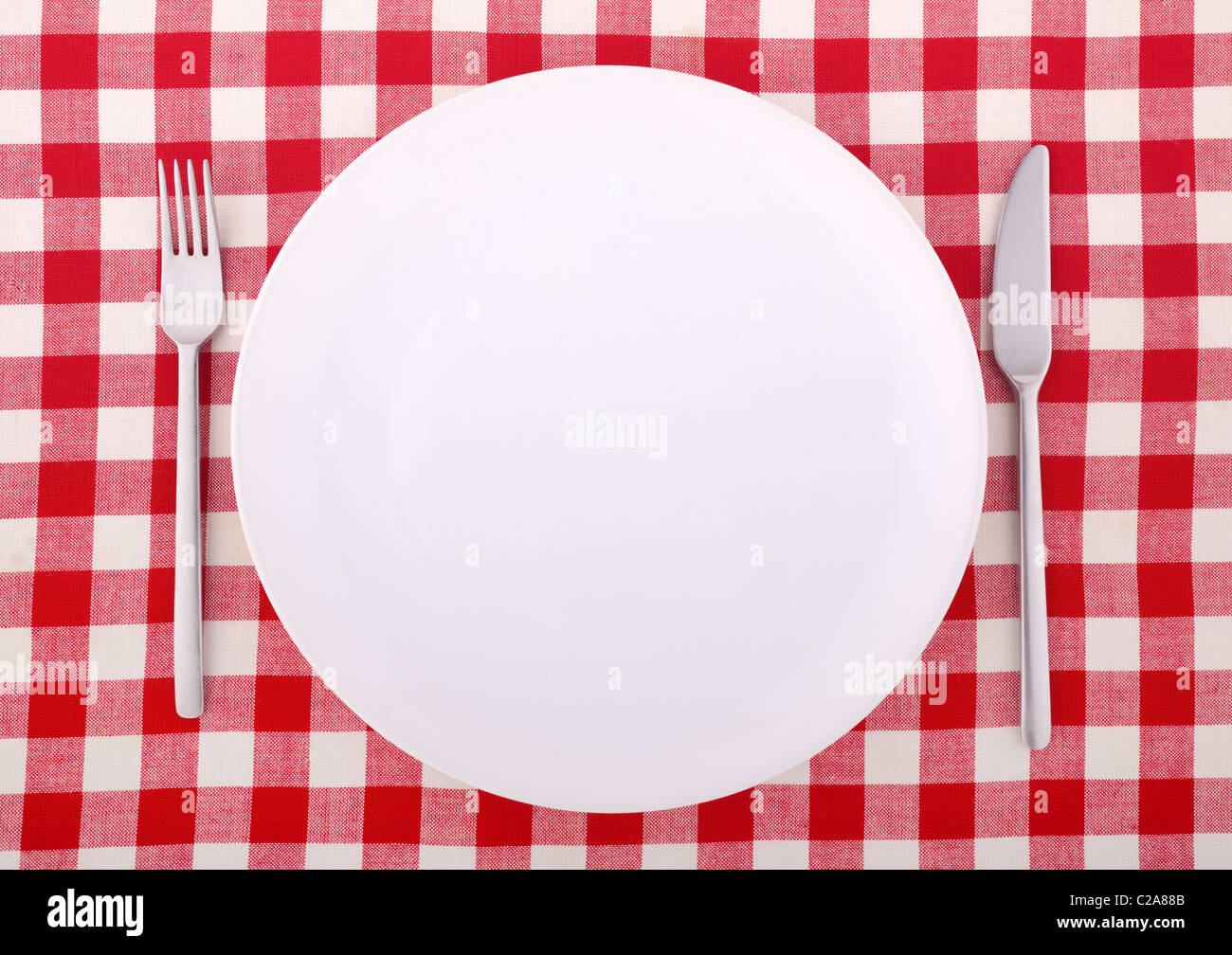 Table setting with fork, knife and an empty plate Stock Photo - Alamy
