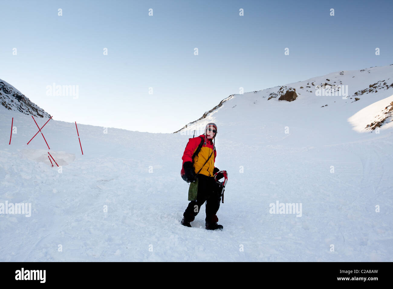 A female mountaineer on a snow filled slope, Svalbard, Norway Stock ...