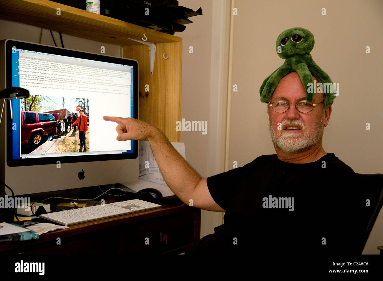 man with toy octopus on head Stock Photo - Alamy