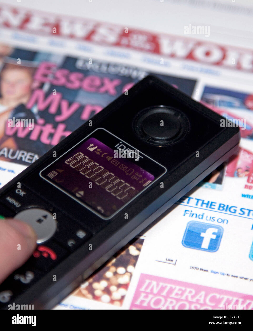 Telephone and News of the World newspaper Stock Photo - Alamy