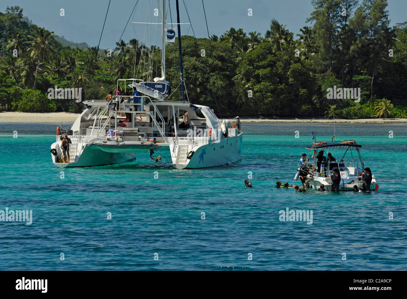 Diving catamaran and boat at Baie Ternay Marine National Park, Mahé ...
