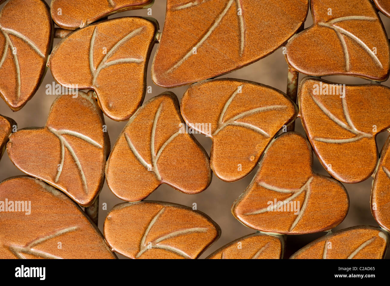 Leaf pattern detail from a metal garden bench Stock Photo - Alamy