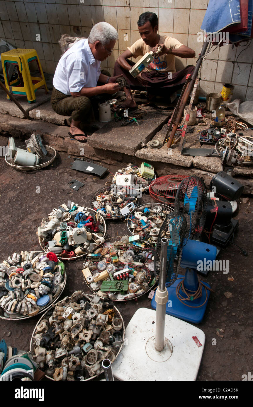 Hawcker selling fans sapre parts on the pavement. yangon. myanmar Stock ...