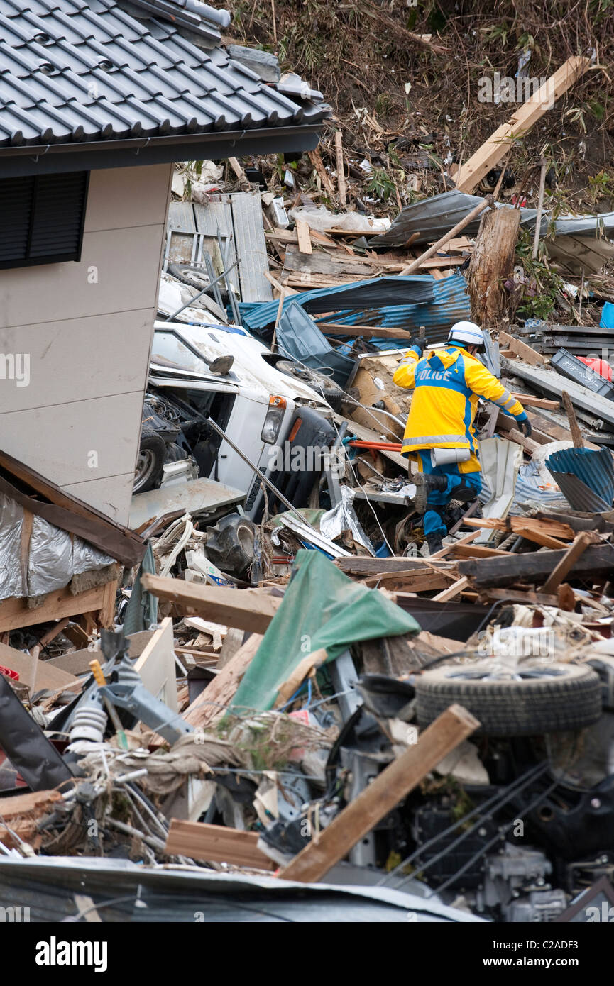 Japanese search and rescue teams search for survivors after thousands ...
