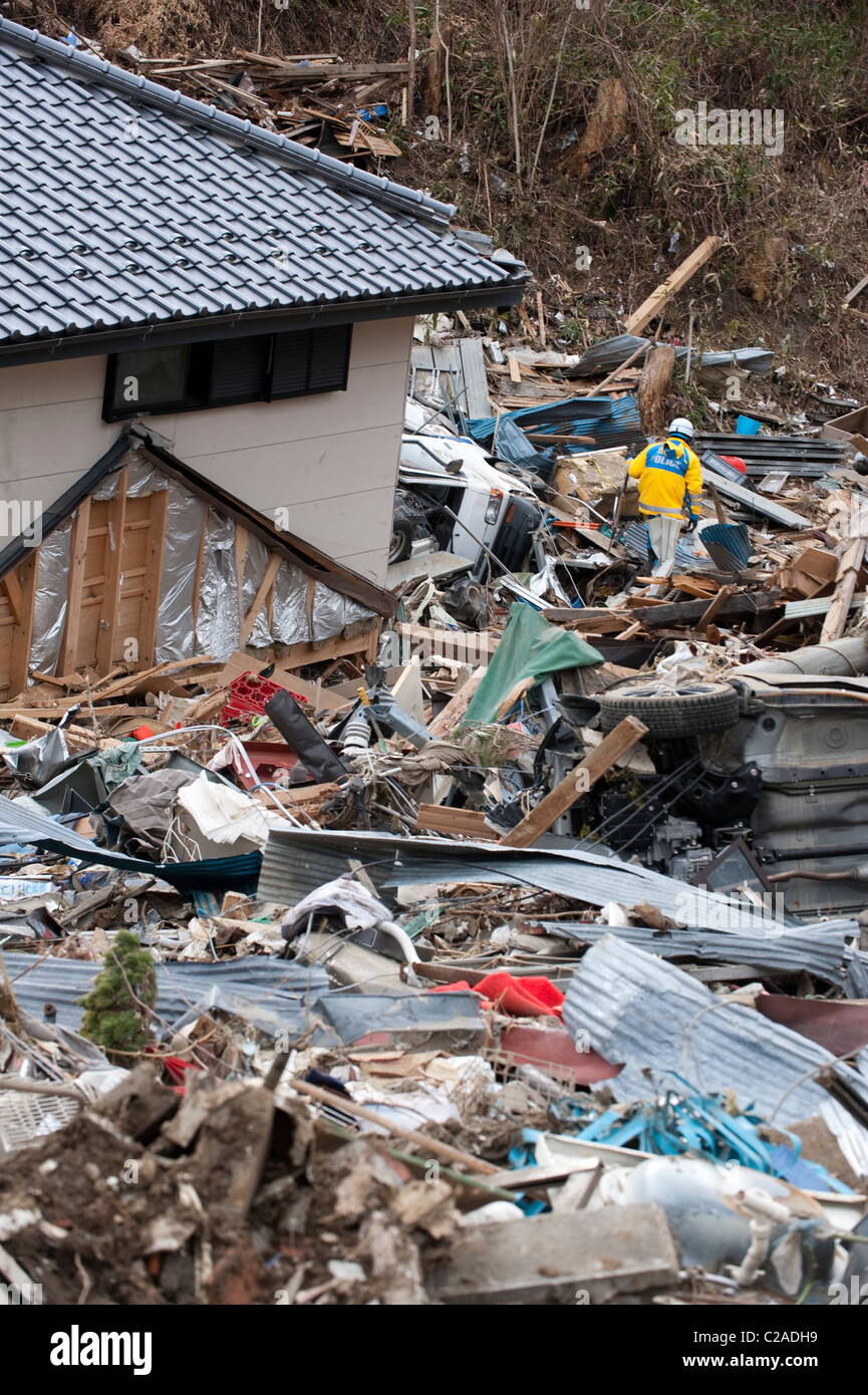Japanese search and rescue teams search for survivors after thousands ...