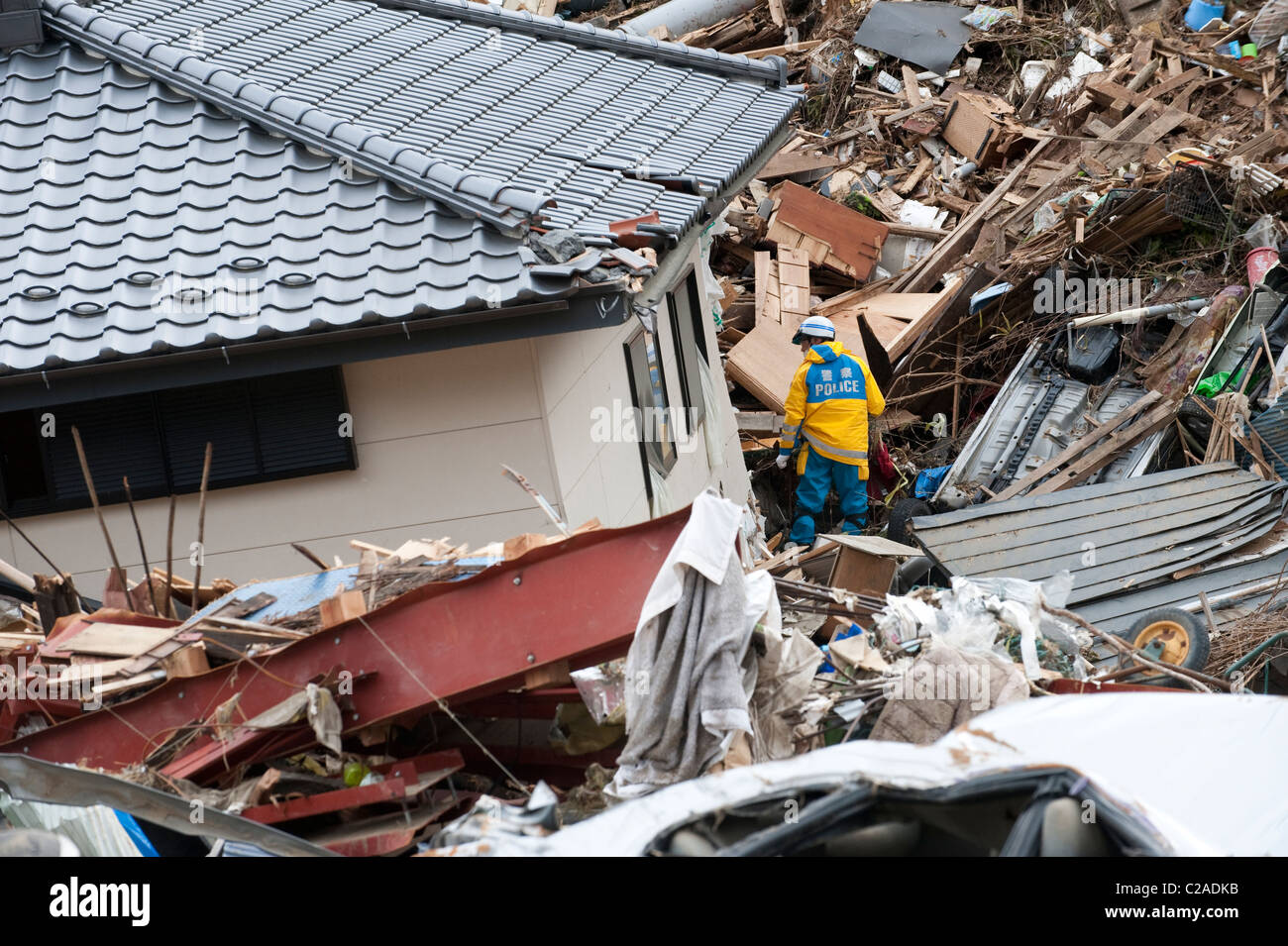 Japanese search and rescue teams search for survivors after thousands ...