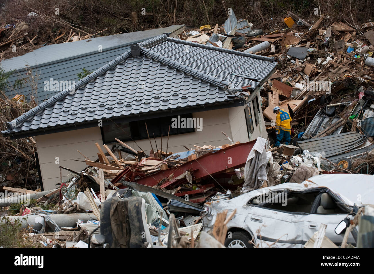 Japanese search and rescue teams search for survivors after thousands ...