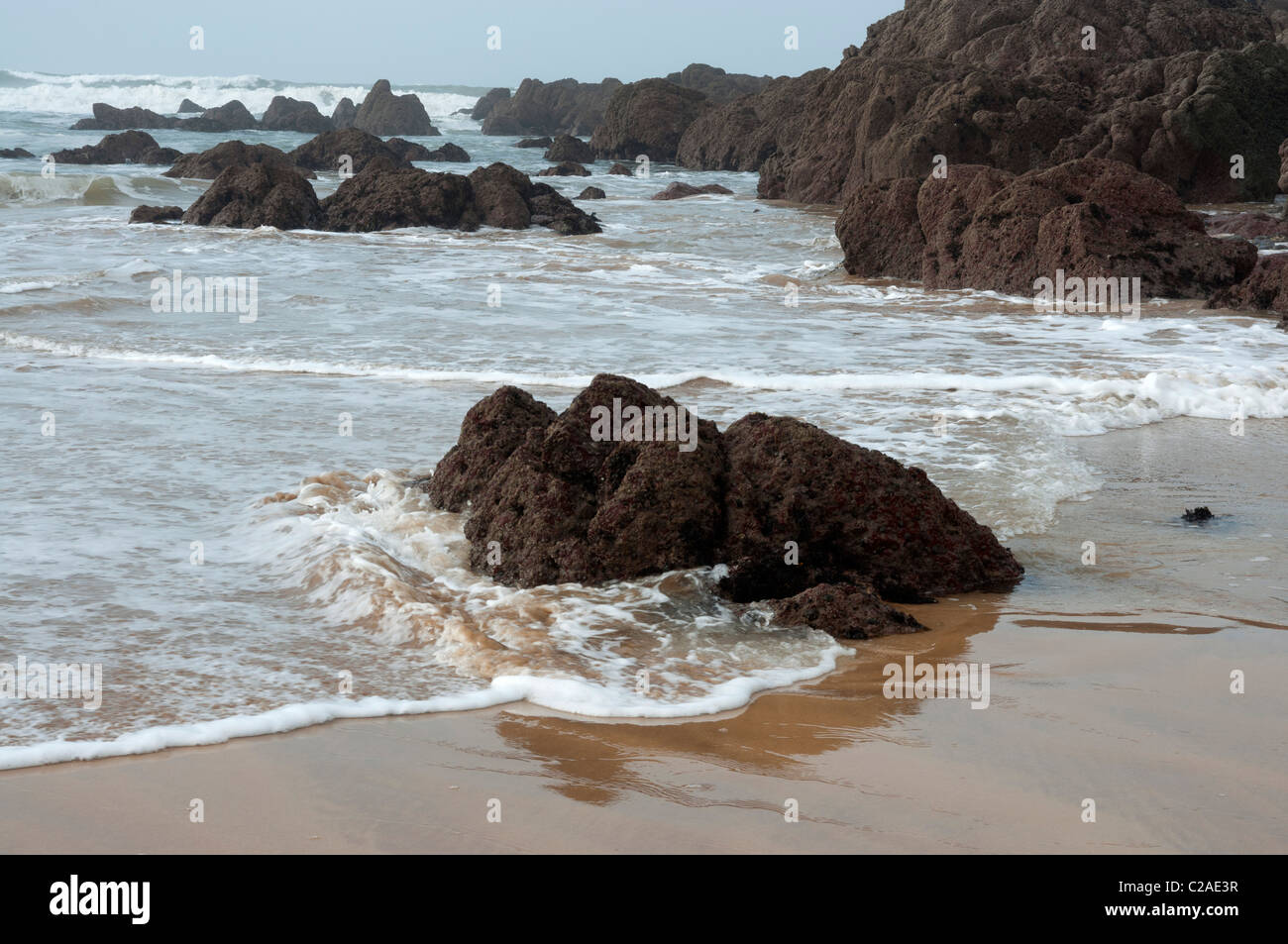 incoming tide around Rocks on Beach Freshwater West pembrokeshire Wales ...