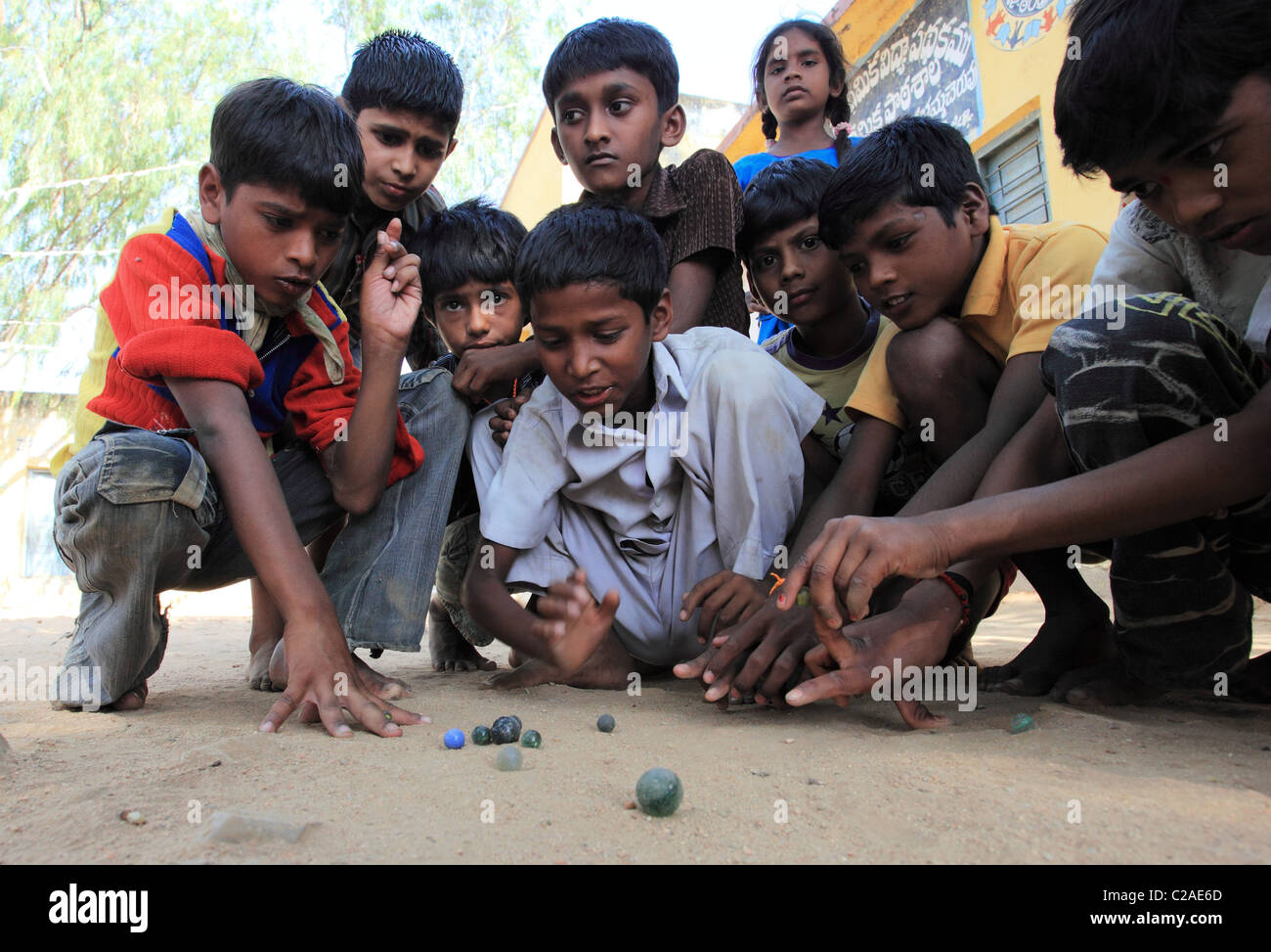 Indian boys playing with marbles Andhra Pradesh South India Stock Photo ...