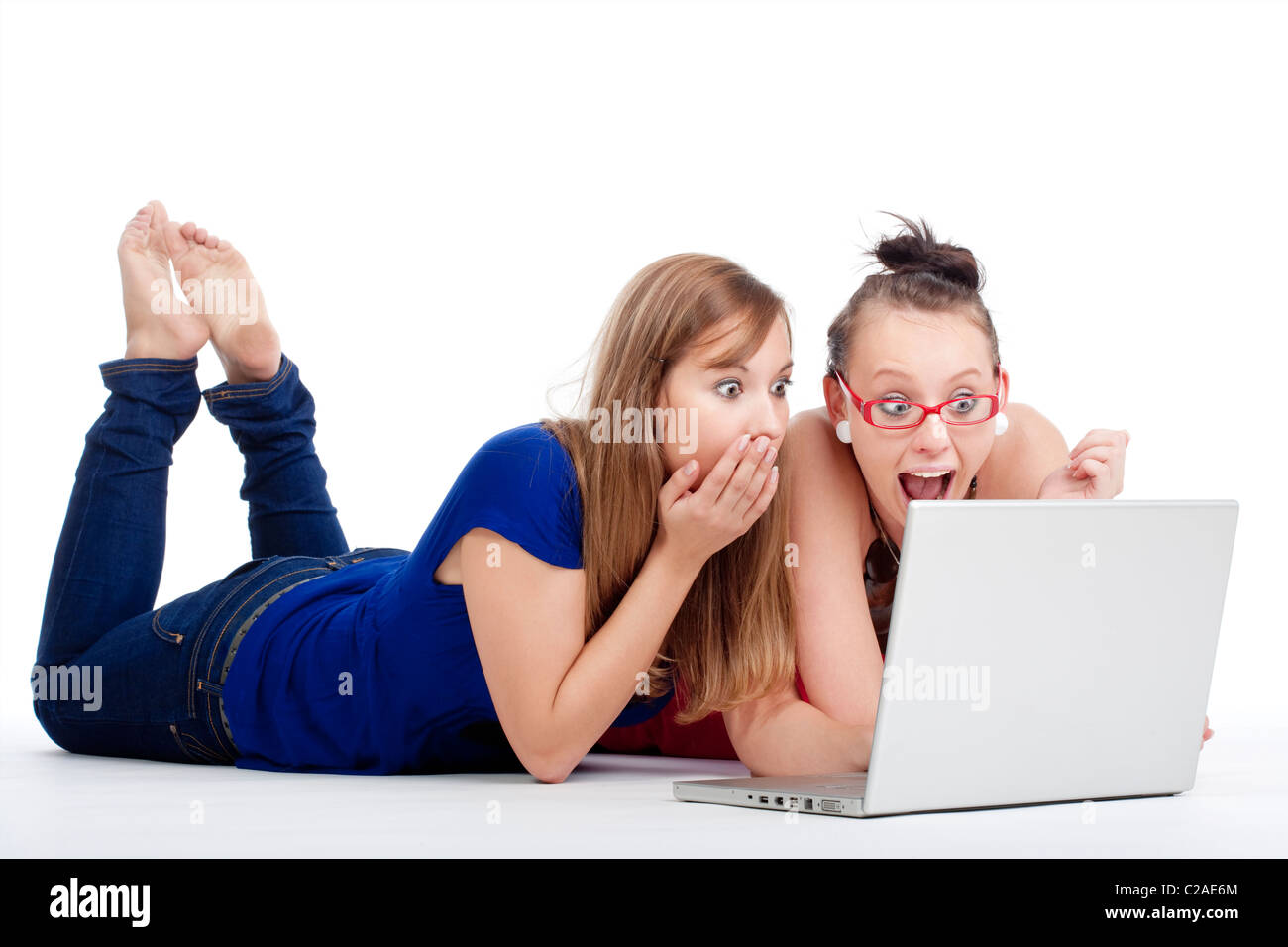 two young female friends having fun with laptop computer Stock Photo ...