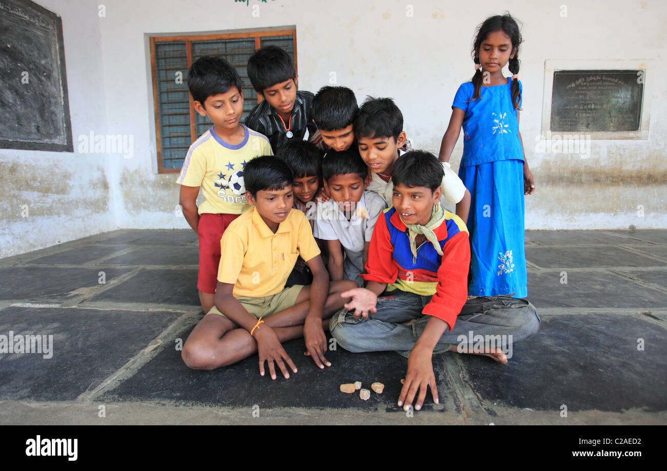 Children with stones hi-res stock photography and images - Alamy