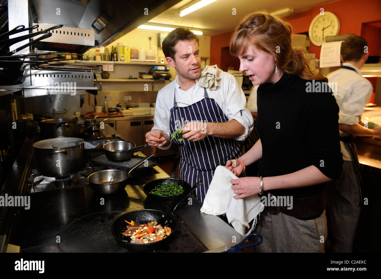 Chef Matt Tebbutt instructs a member of a foraging trip cooking their ...