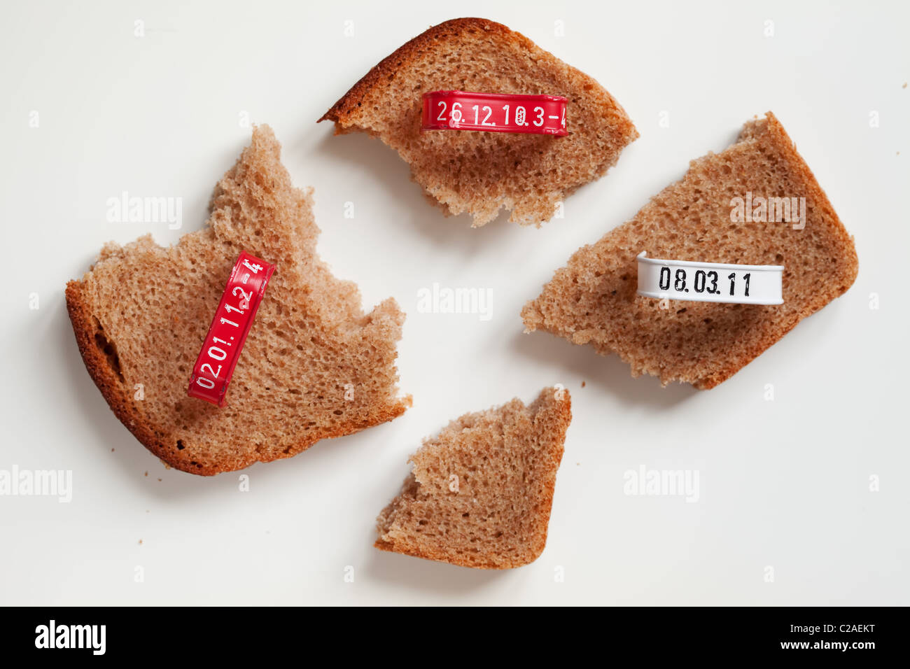 Four pieces of bread slice and seals with printed production date Stock ...